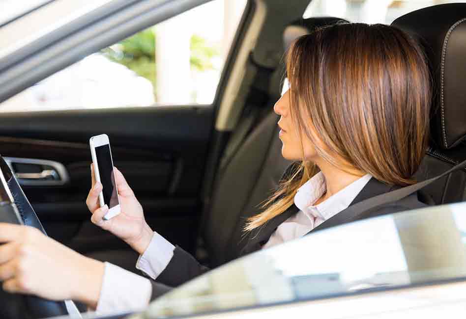 Hand-held phone ban while driving in work and school zones begins Tuesday